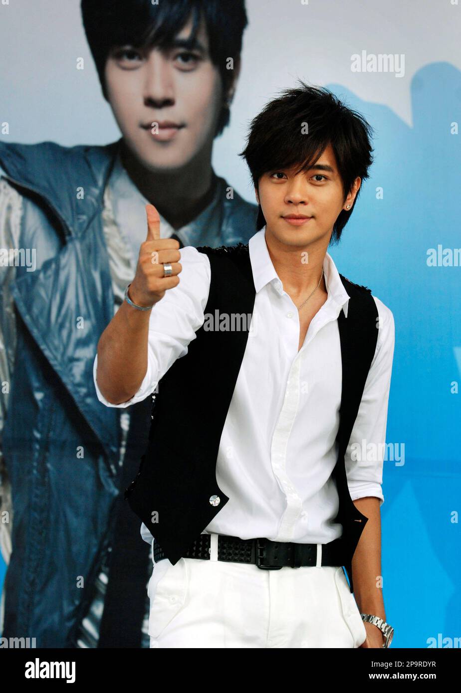 Taiwanese pop singer Show poses for photographers during an event to ...