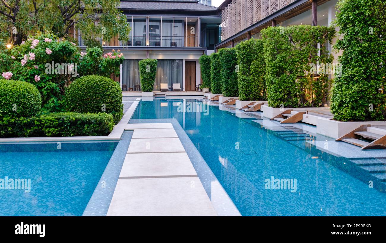 Luxury 5 star hotel pool in Asia with chairs Stock Photo - Alamy