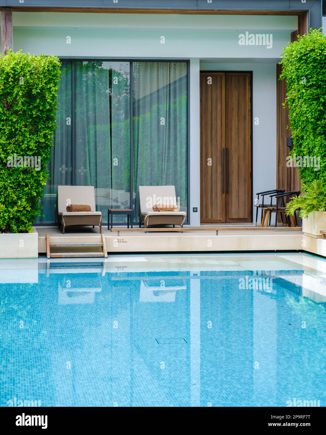 Luxury 5 star hotel pool in Asia with chairs Stock Photo - Alamy