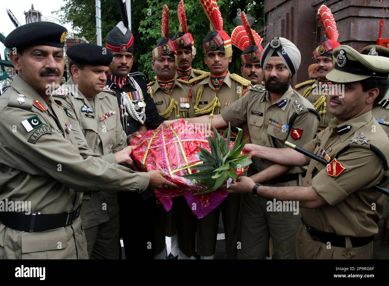Indian Border Security Force's commander Muhammad Aquil, right, offers ...