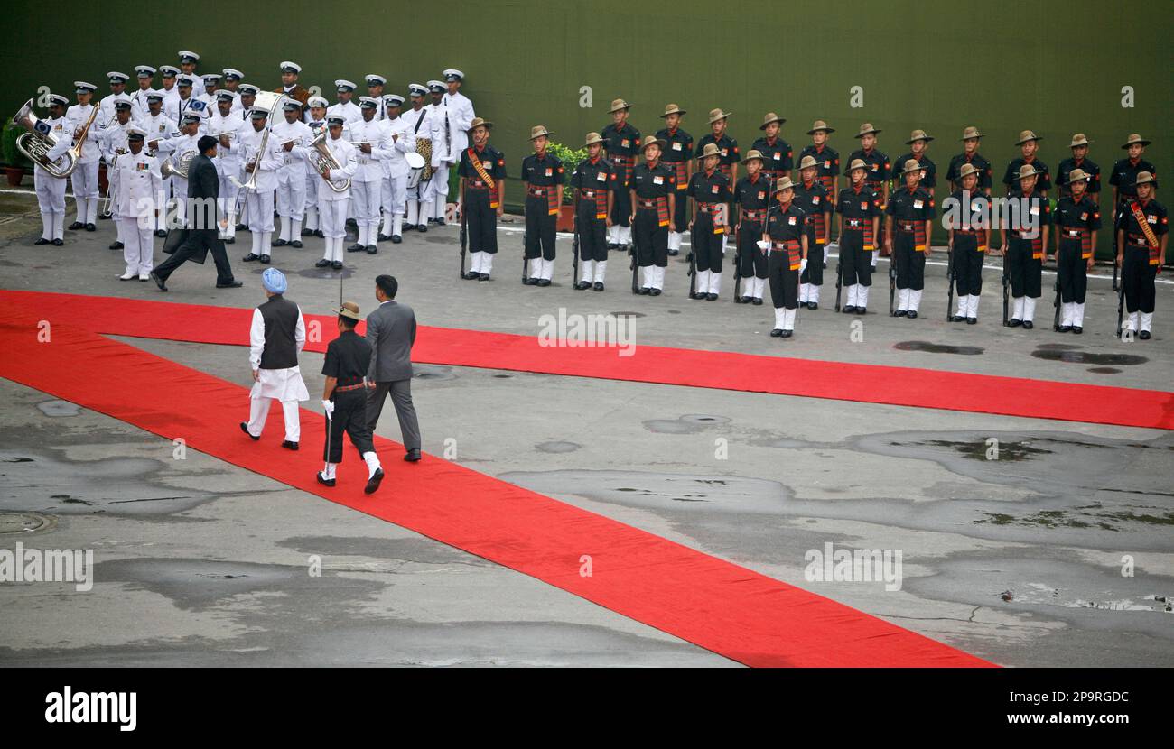 Indian Prime Minister Manmohan Singh, wearing blue turban, inspects the ...