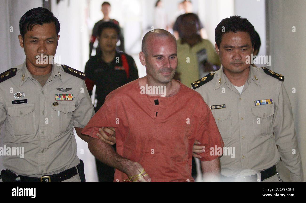 Thai prison guards escort Canadian Christopher Paul Neil, center, at ...