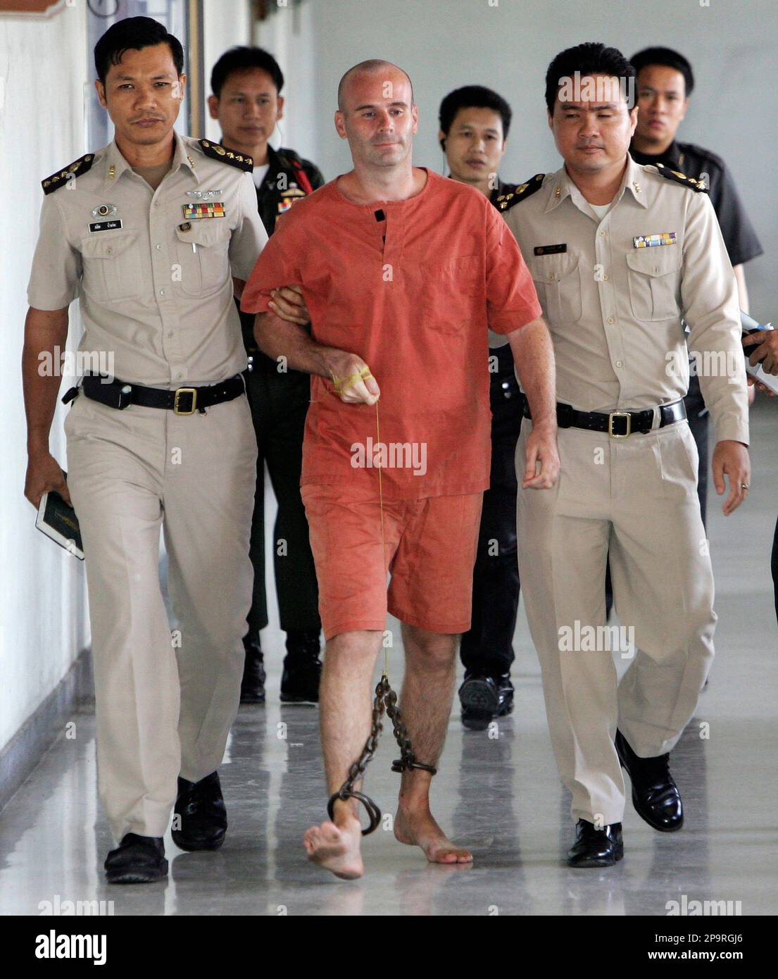 Thai prison guards escort Canadian Christopher Paul Neil, center, at criminal court in Bangkok ...