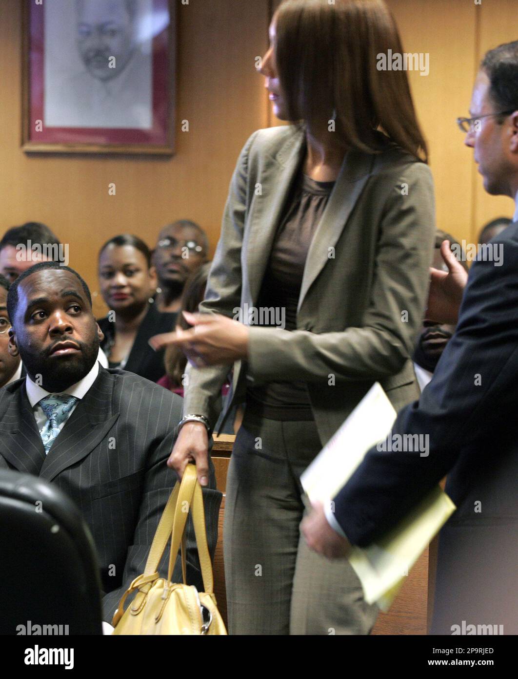 Detroit Mayor Kwame Kilpatrick, left, watches his former chief of staff ...
