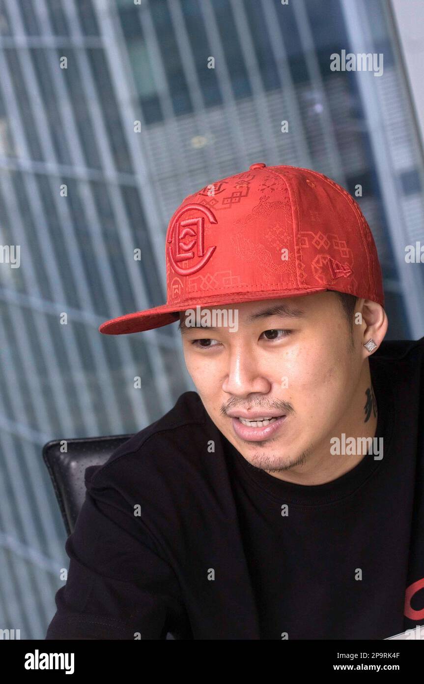 American-born-Chinese rapper MC Jin talks during an interview with the ...