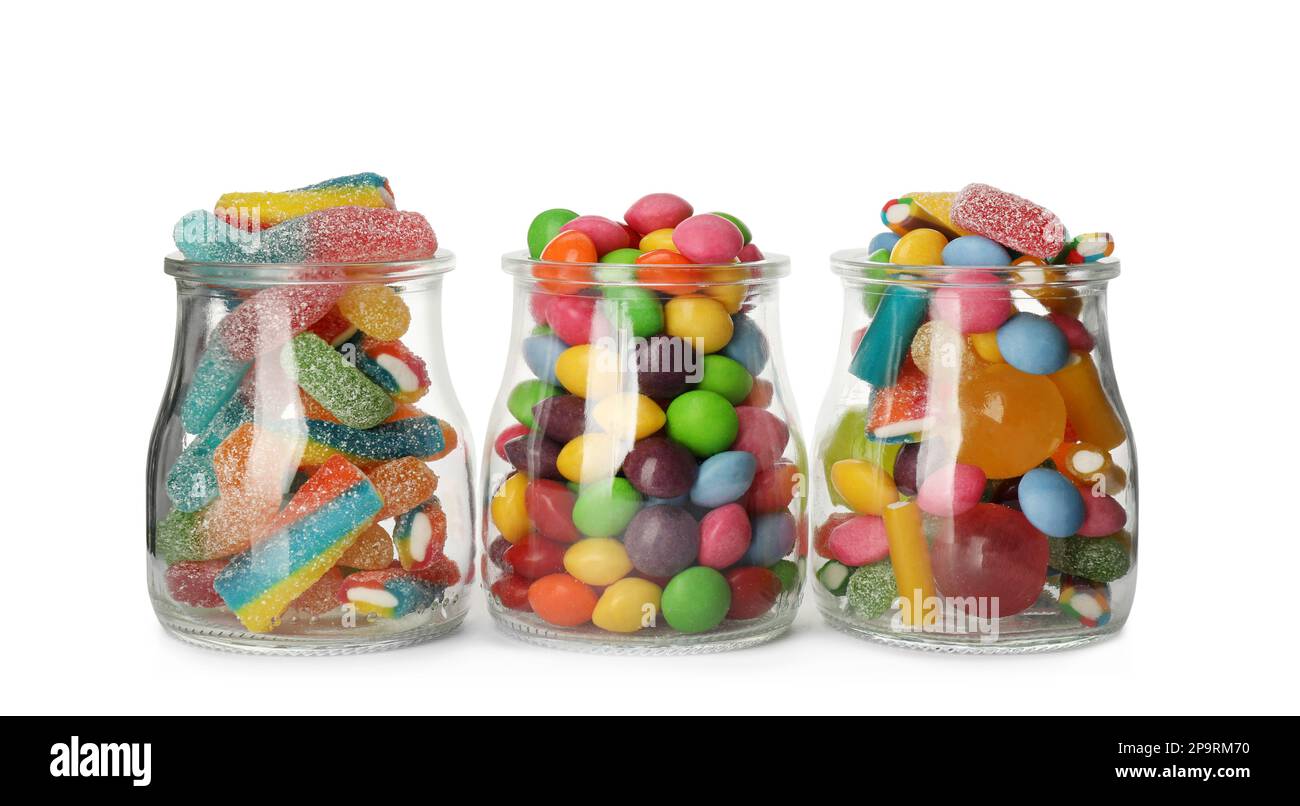 Glass jars with different candies on white background Stock Photo - Alamy