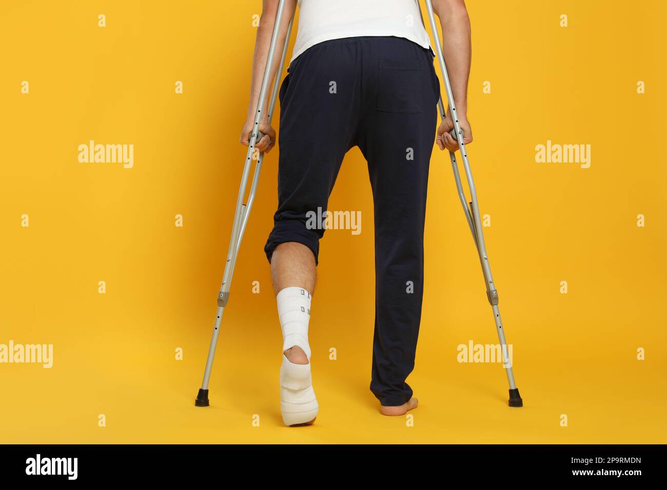 Legs man standing crutches hi-res stock photography and images - Alamy