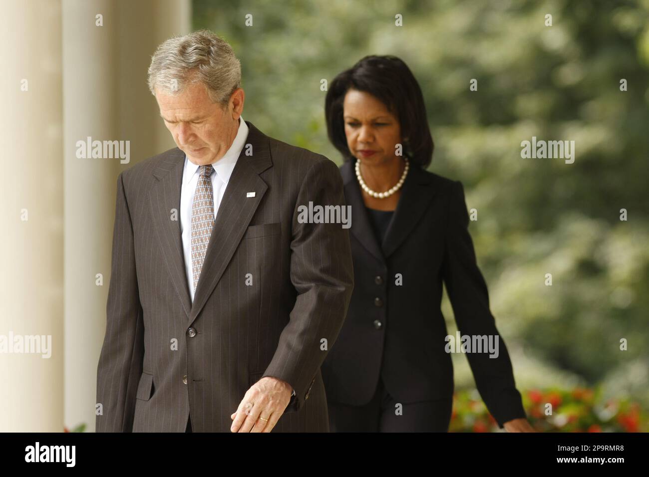 President Bush, followed by Secretary of State Condoleezza Rice, walks ...