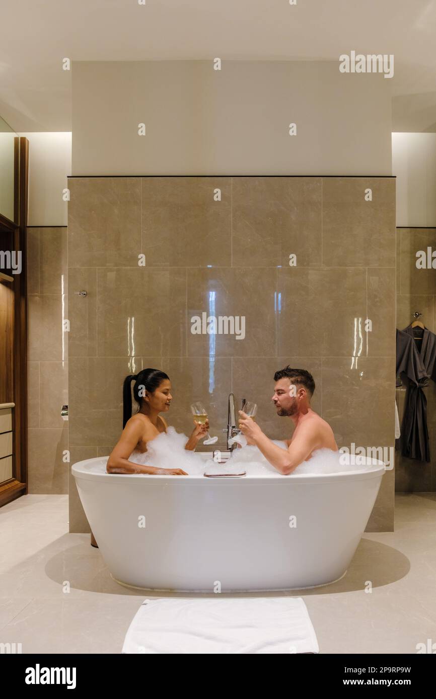 couple in a bath tub in a luxury hotel bathroom Stock Photo - Alamy