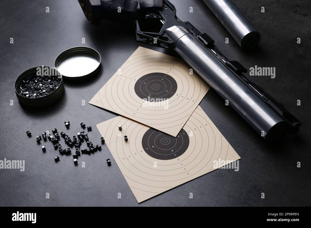Composition with sport pistol on black table. Professional gun Stock ...
