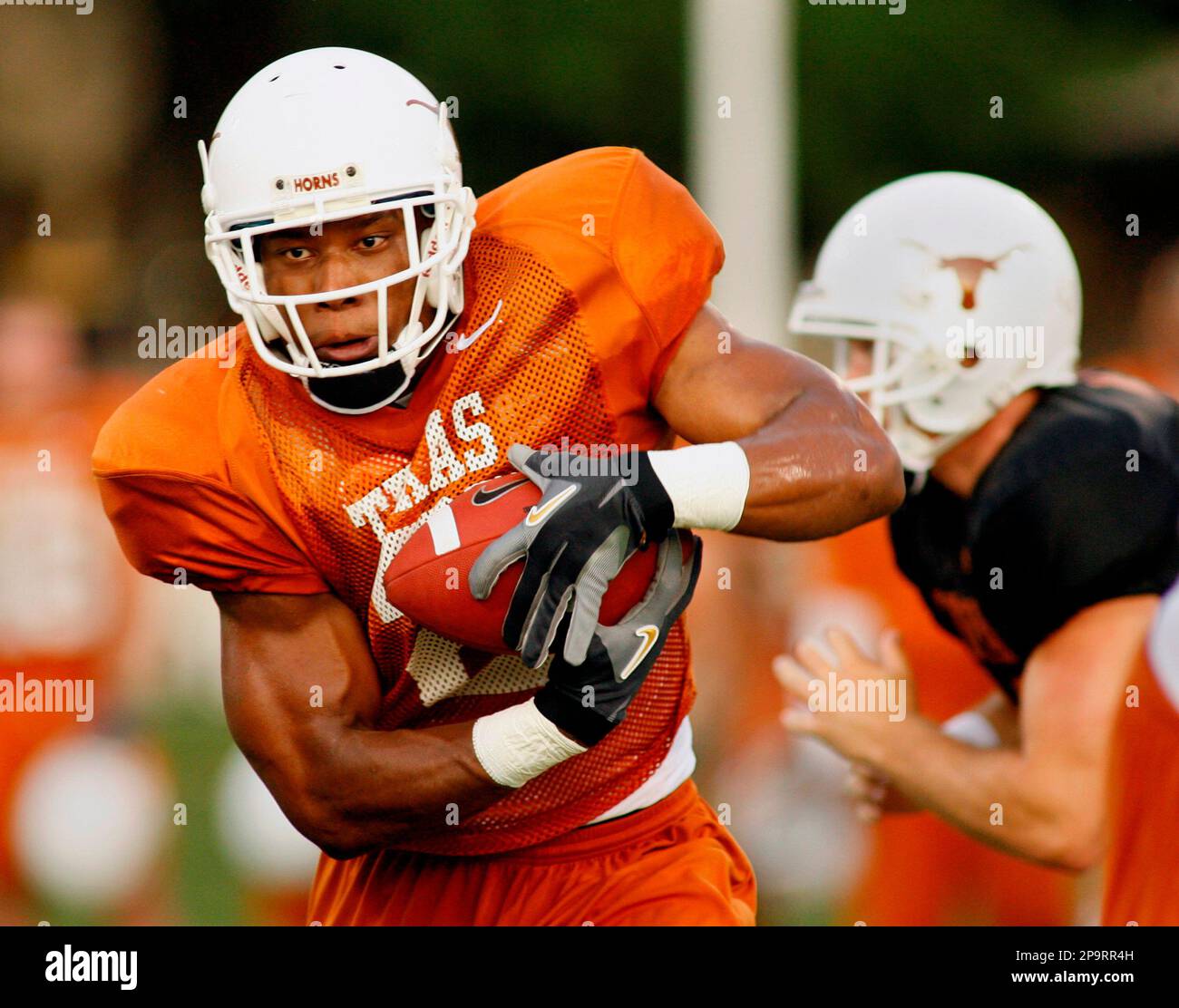 Texas running back Vondrell McGee is shown after taking a handoff from ...