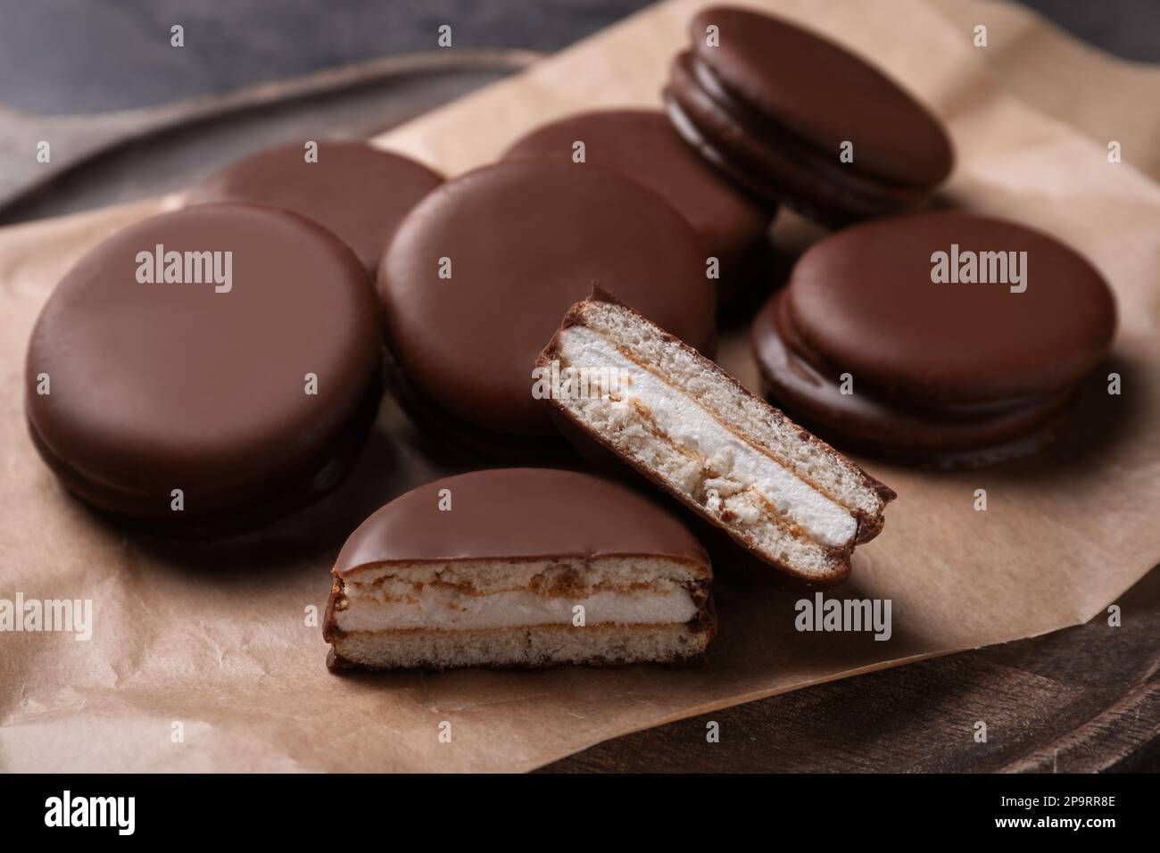 Tasty choco pies on parchment paper, closeup view Stock Photo - Alamy