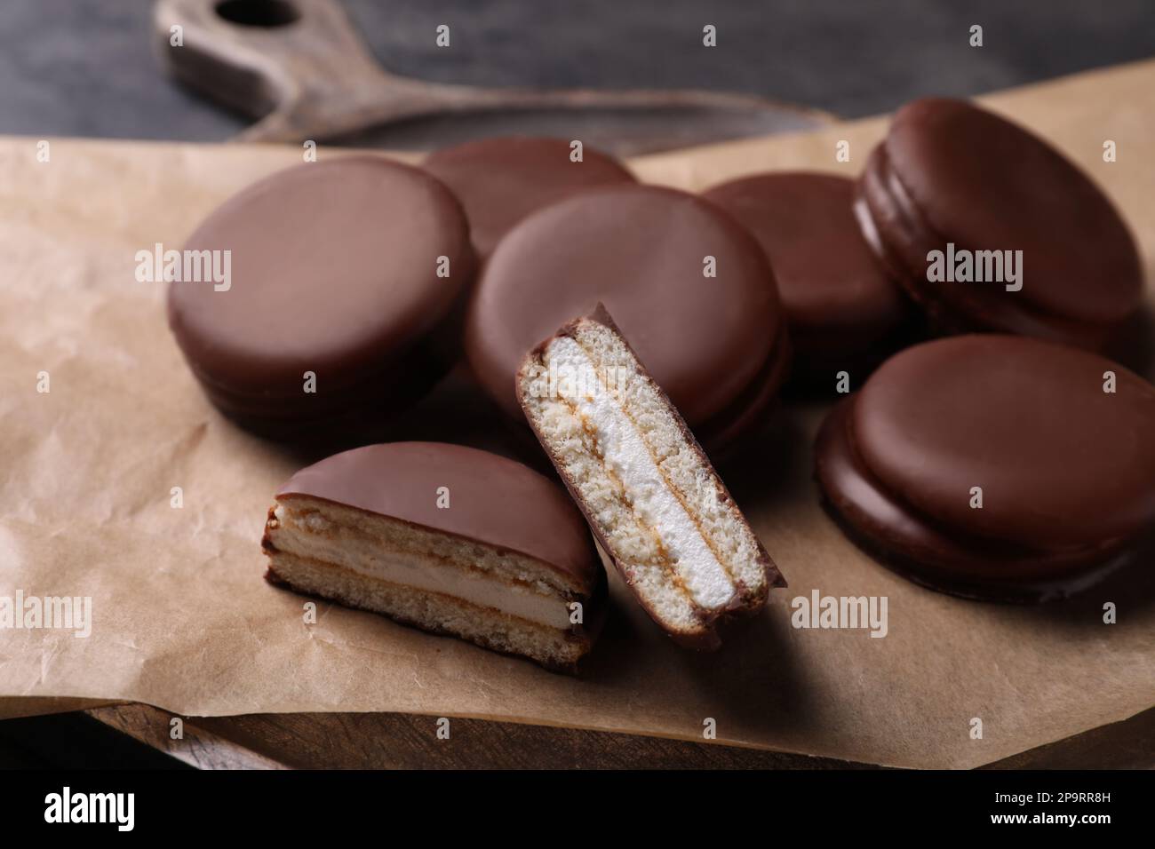 Tasty choco pies on parchment paper, closeup view Stock Photo - Alamy