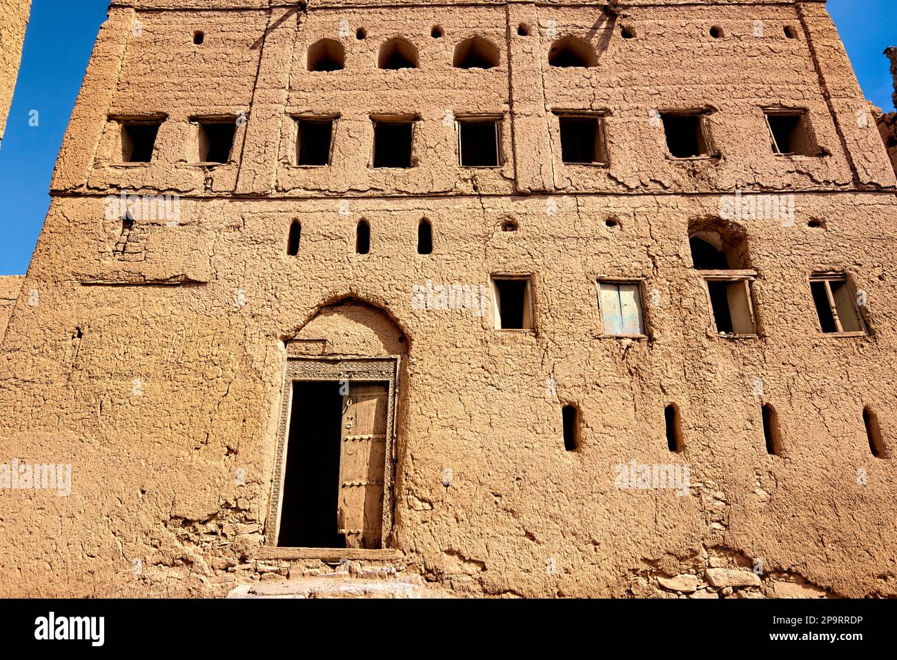 Falling down mud-brick ruins of the old village in Al Hamra, Oman Stock ...