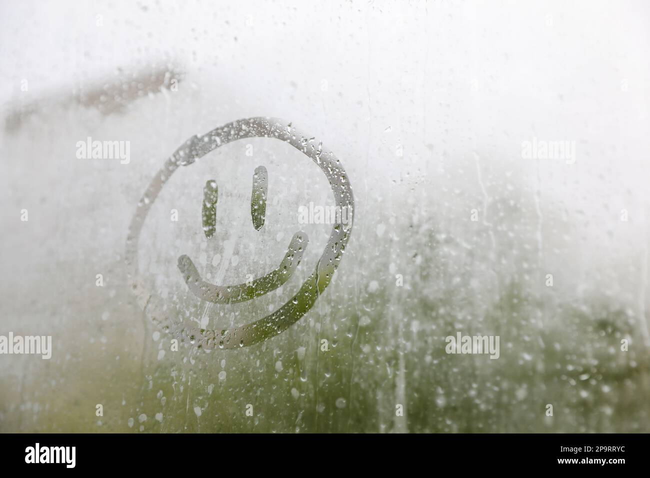Funny face drawn on foggy window, space for text. Rainy weather Stock ...
