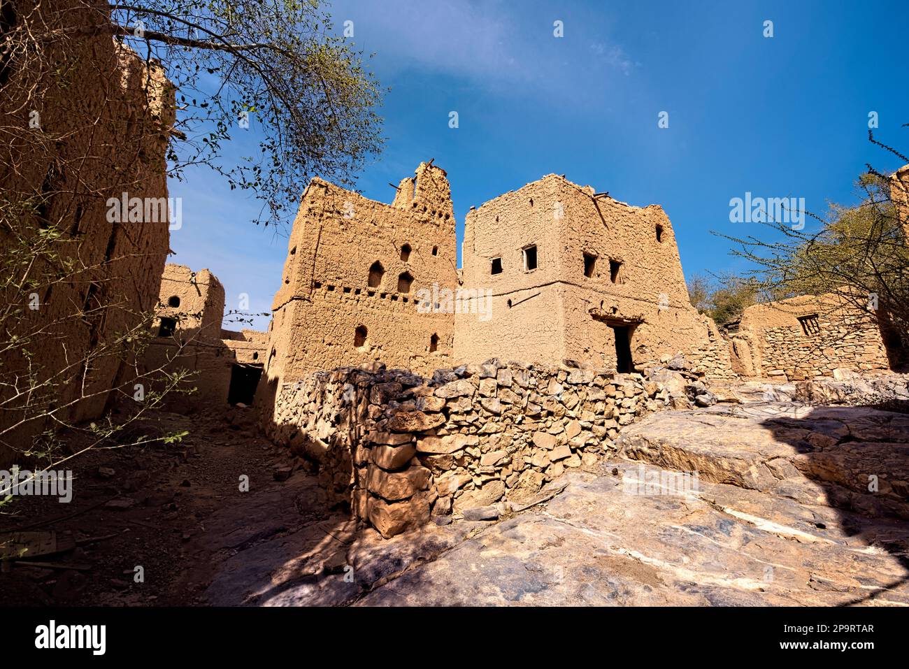 Falling down mud-brick ruins of the old village in Al Hamra, Oman Stock ...