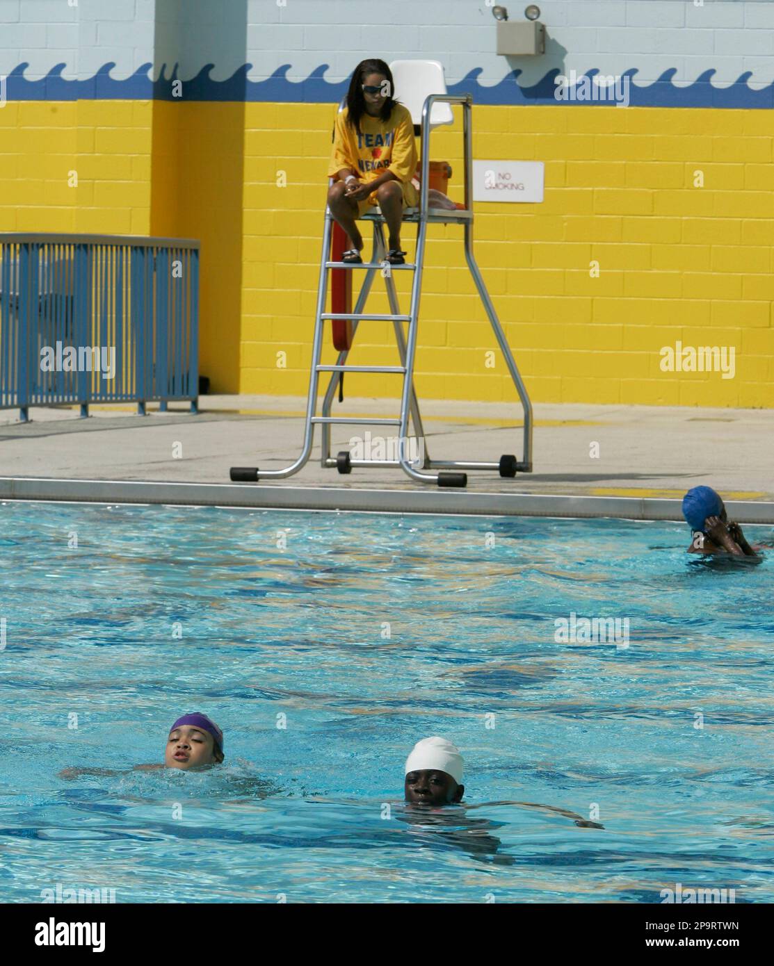 Two young swimmers, Shadaziha Vines, 10, right forground, and ...