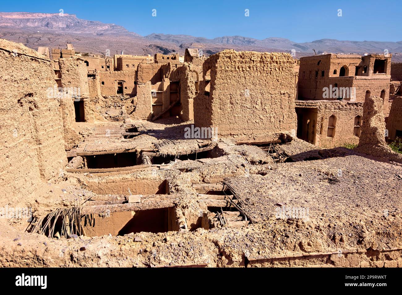 Falling down mud-brick ruins of the old village in Al Hamra, Oman Stock ...