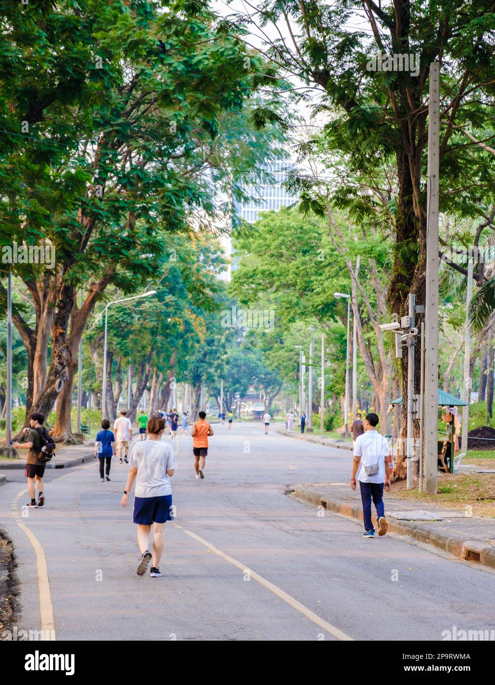 Lumpini park Bangkok Thailand March 2023, people running in the park with a air polluted sky pm ...
