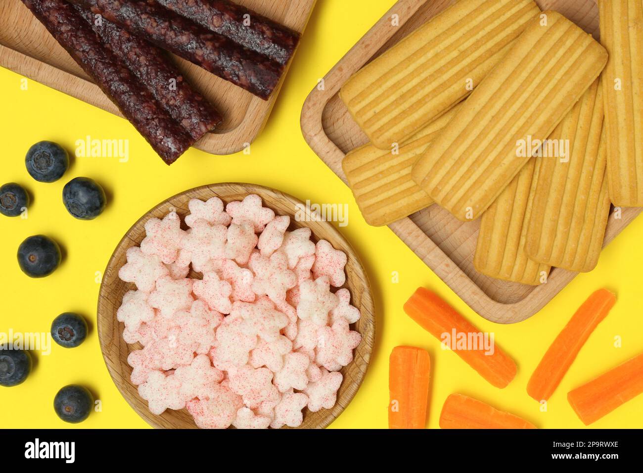 Different finger foods for baby on yellow background, flat lay Stock ...