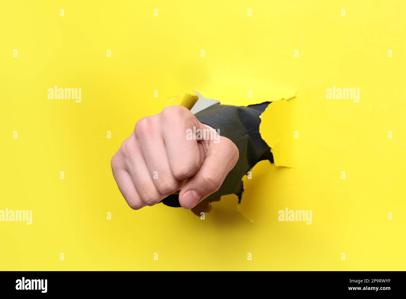 Fist breaking through wall hi-res stock photography and images - Alamy