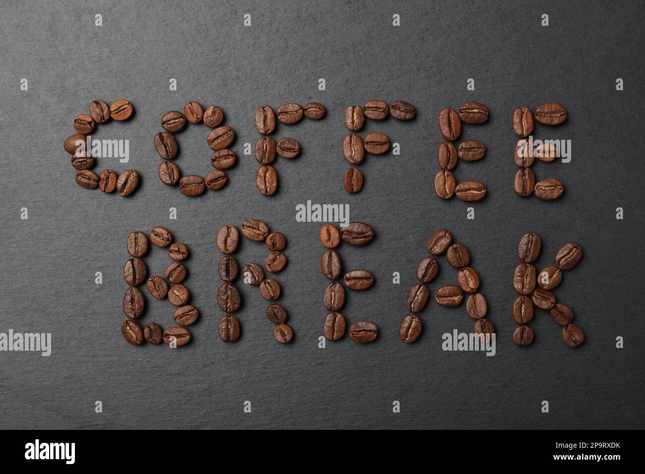 Phrase Coffee Break made of beans on black background, flat lay Stock ...
