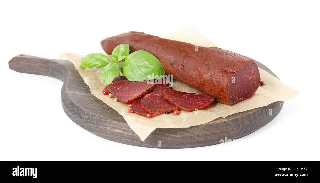 Delicious sliced dry-cured beef basturma with basil and peppercorns on ...