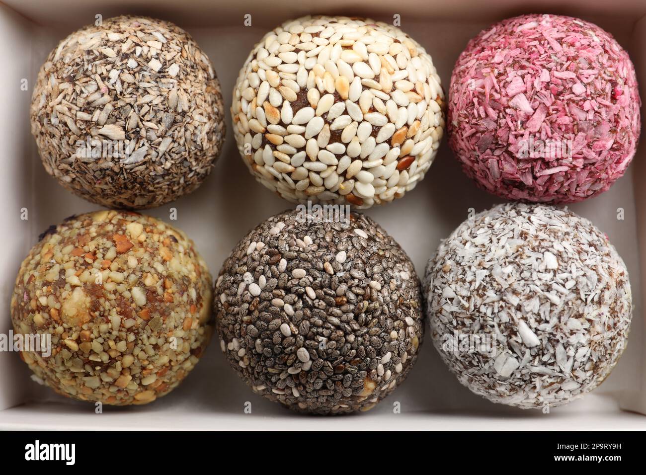 Different delicious vegan candy balls in box, top view Stock Photo - Alamy