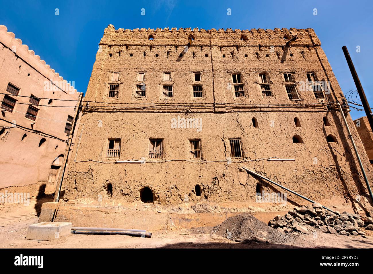 Falling down mud-brick ruins of the old village in Al Hamra, Oman Stock ...