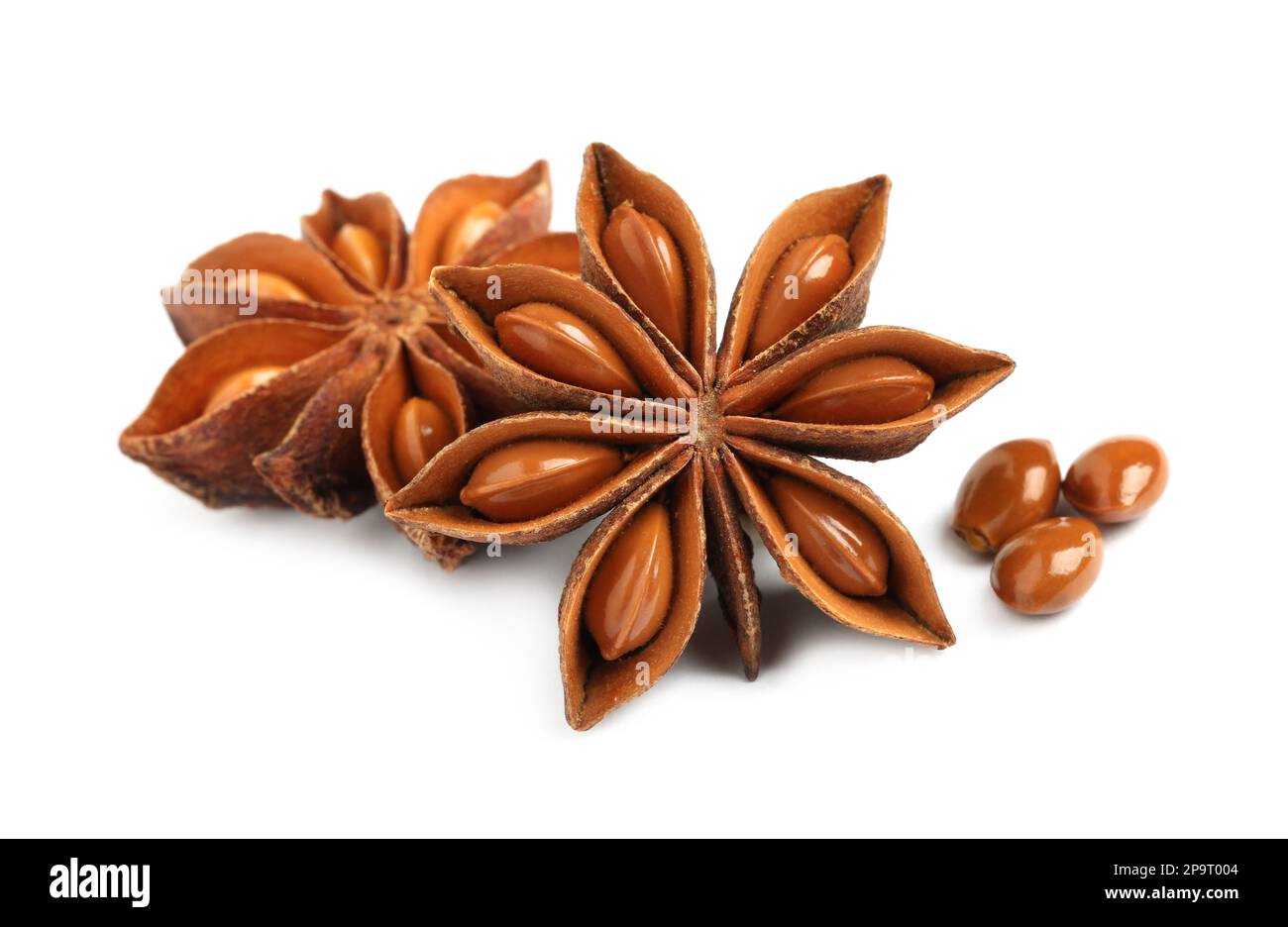 Dry anise stars with seeds on white background Stock Photo - Alamy