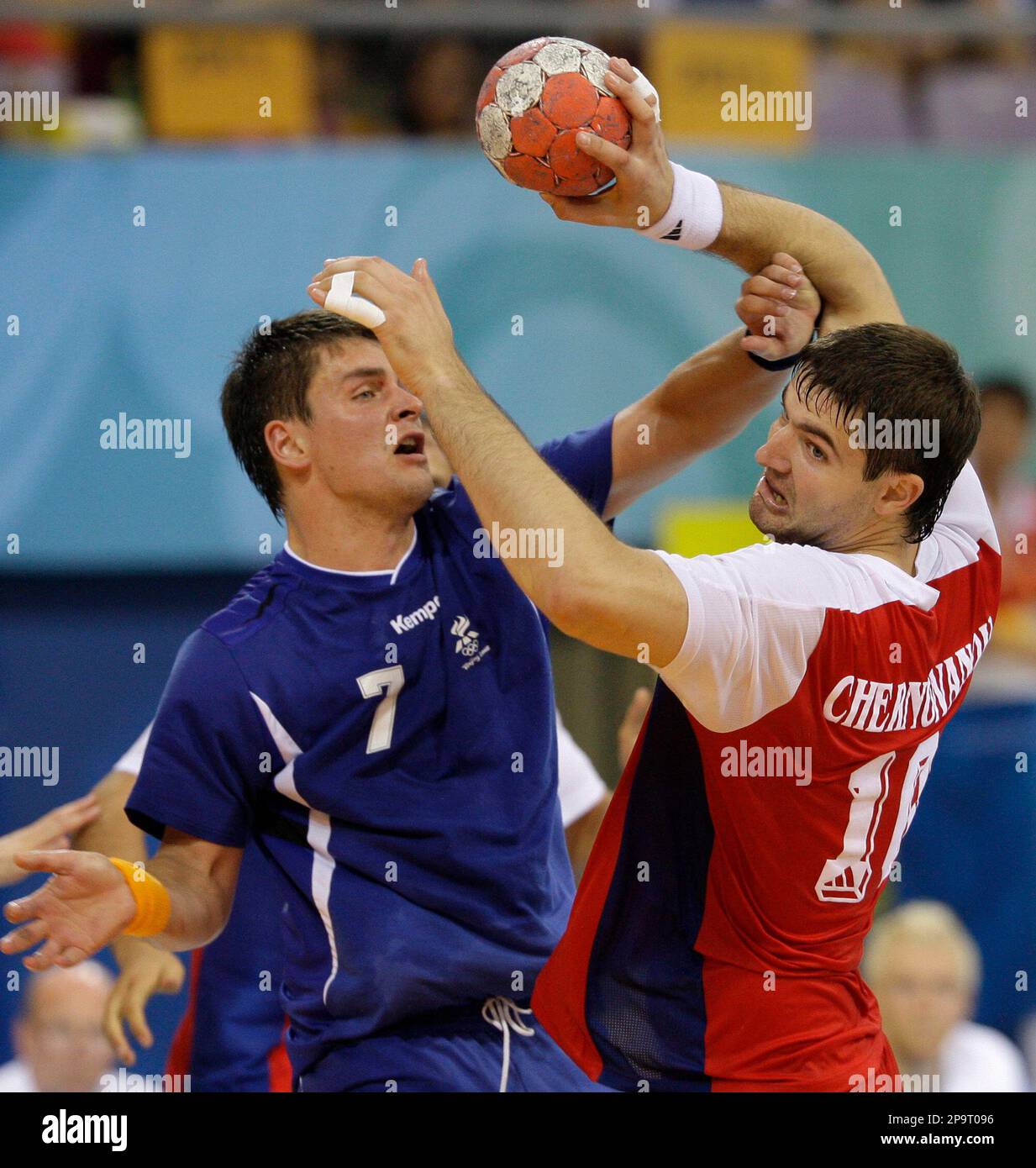 Russia's Alexander Chernoivanov, right, goes to shoot as Iceland's ...
