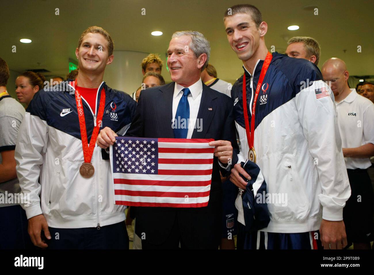 President Bush greets gold medal and world record winner Michael Phelps ...