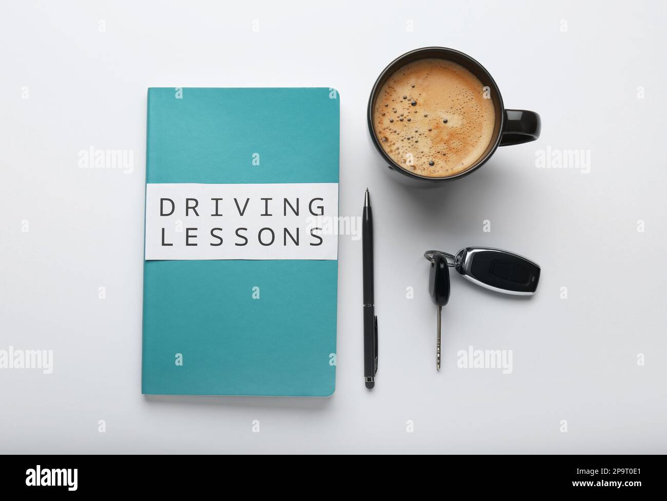 Composition with workbook for driving lessons on white background, top ...