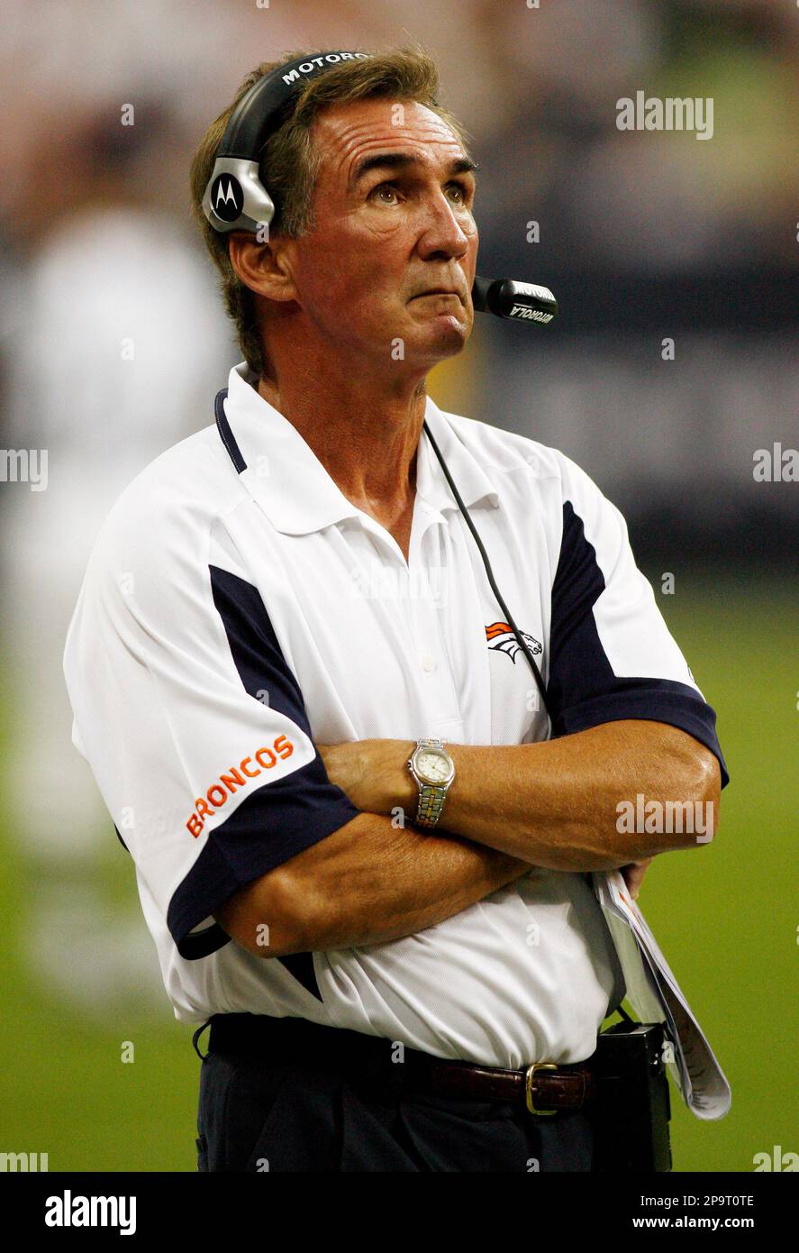 Denver Broncos head coach Mike Shanahan watches a replay during the ...