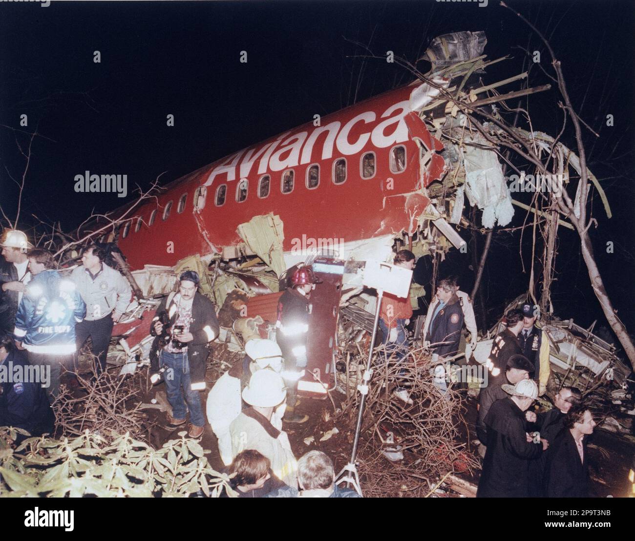 ** FILE ** In this Jan. 26, 1990 file photo, rescue workers climb from ...