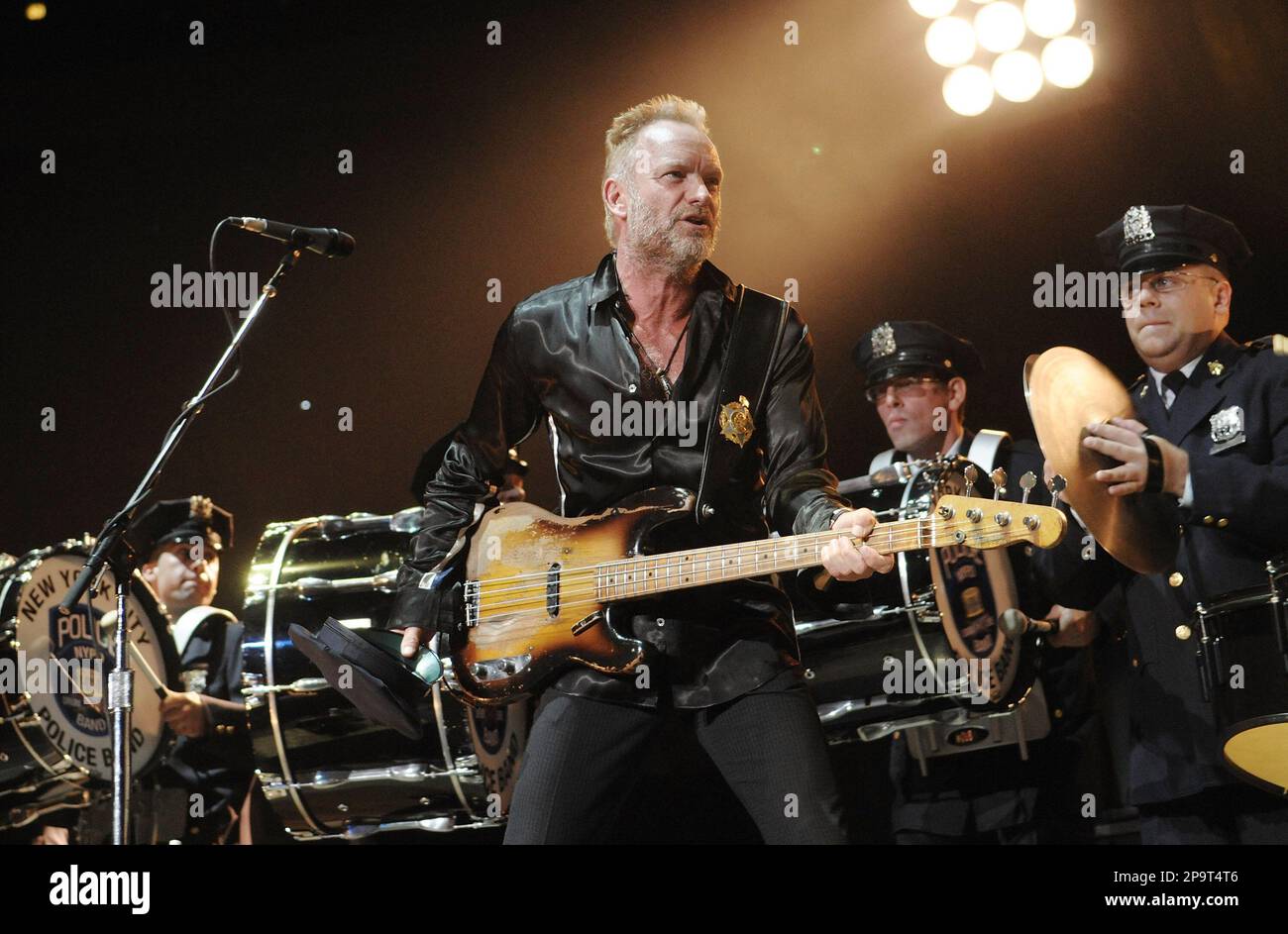 Lead vocalist and bassist Sting, center, and his band The Police are ...