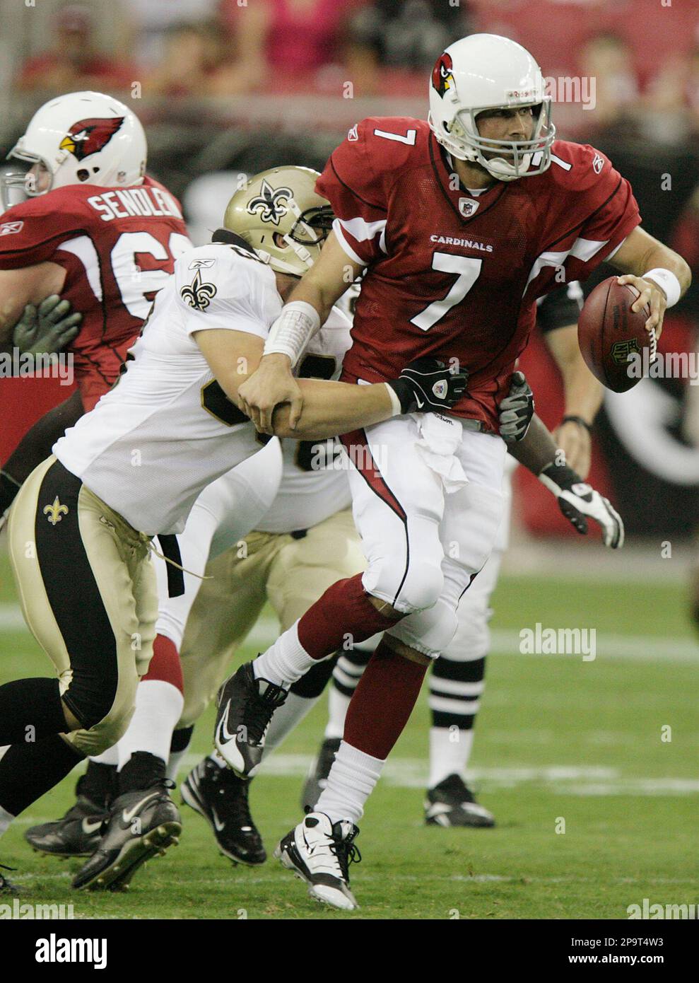 New Orleans Saints' Mark Simoneau, left, tackles Arizona Cardinals ...