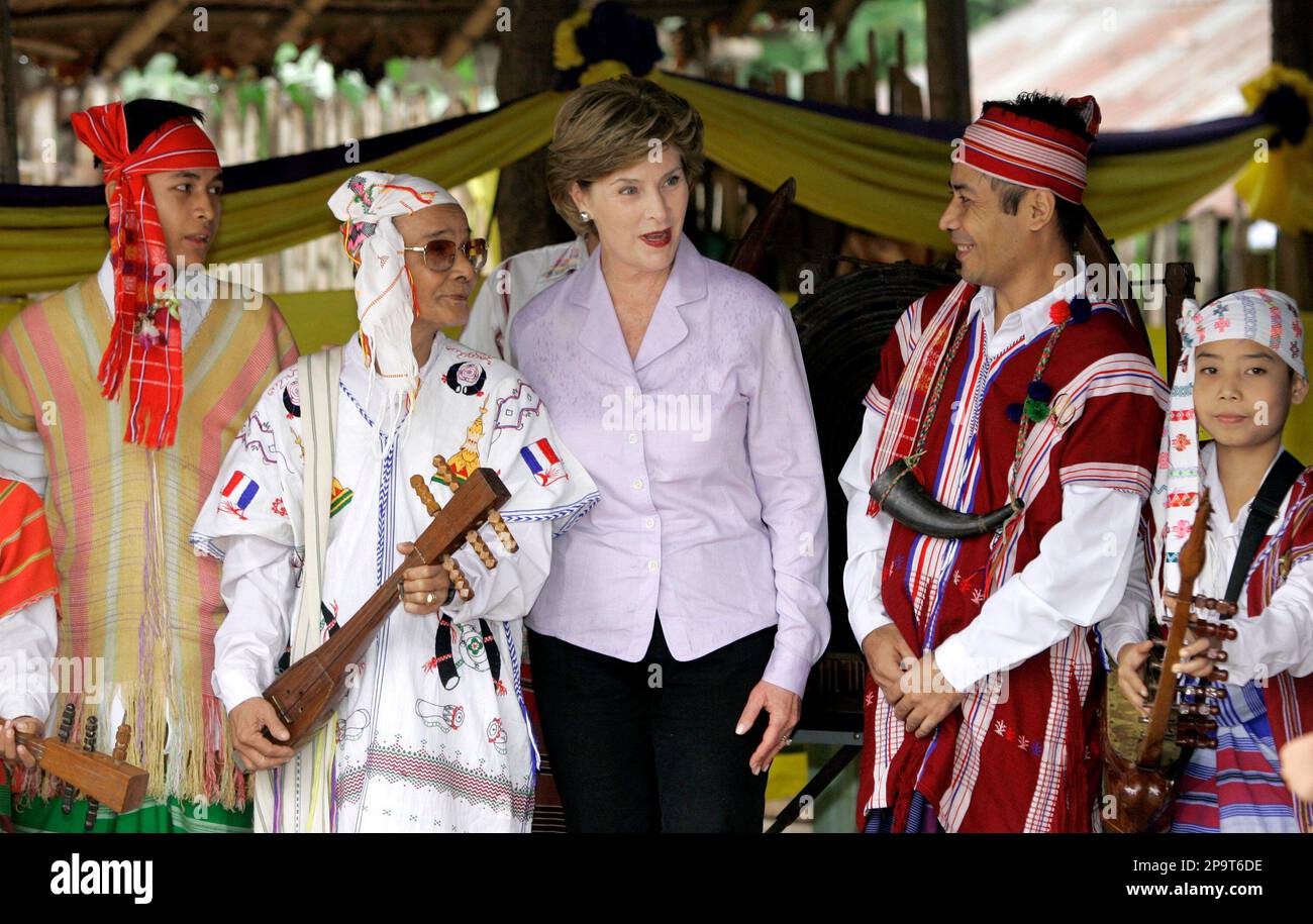 U.S. first lady Laura Bush, center, talks with Karen refugees in ...