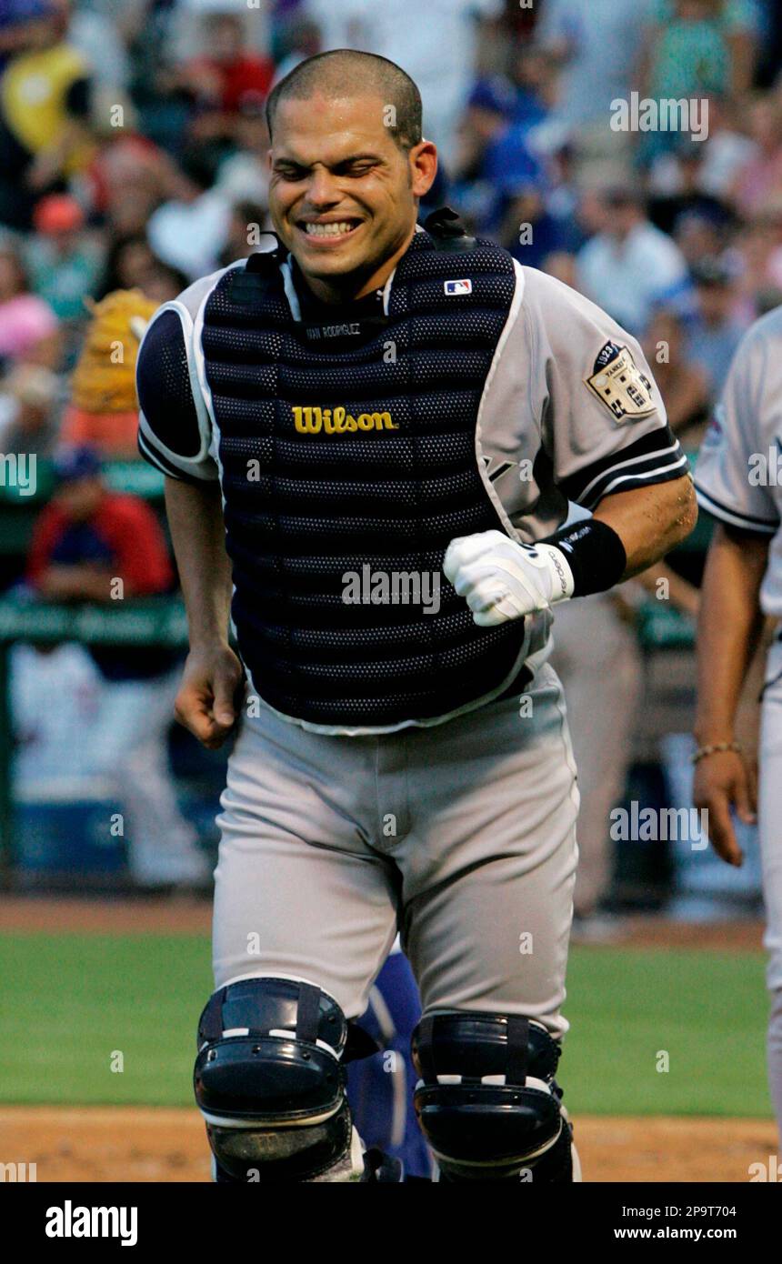 New York Yankees catcher Ivan Rodriguez grimaces as he jogs back to the ...