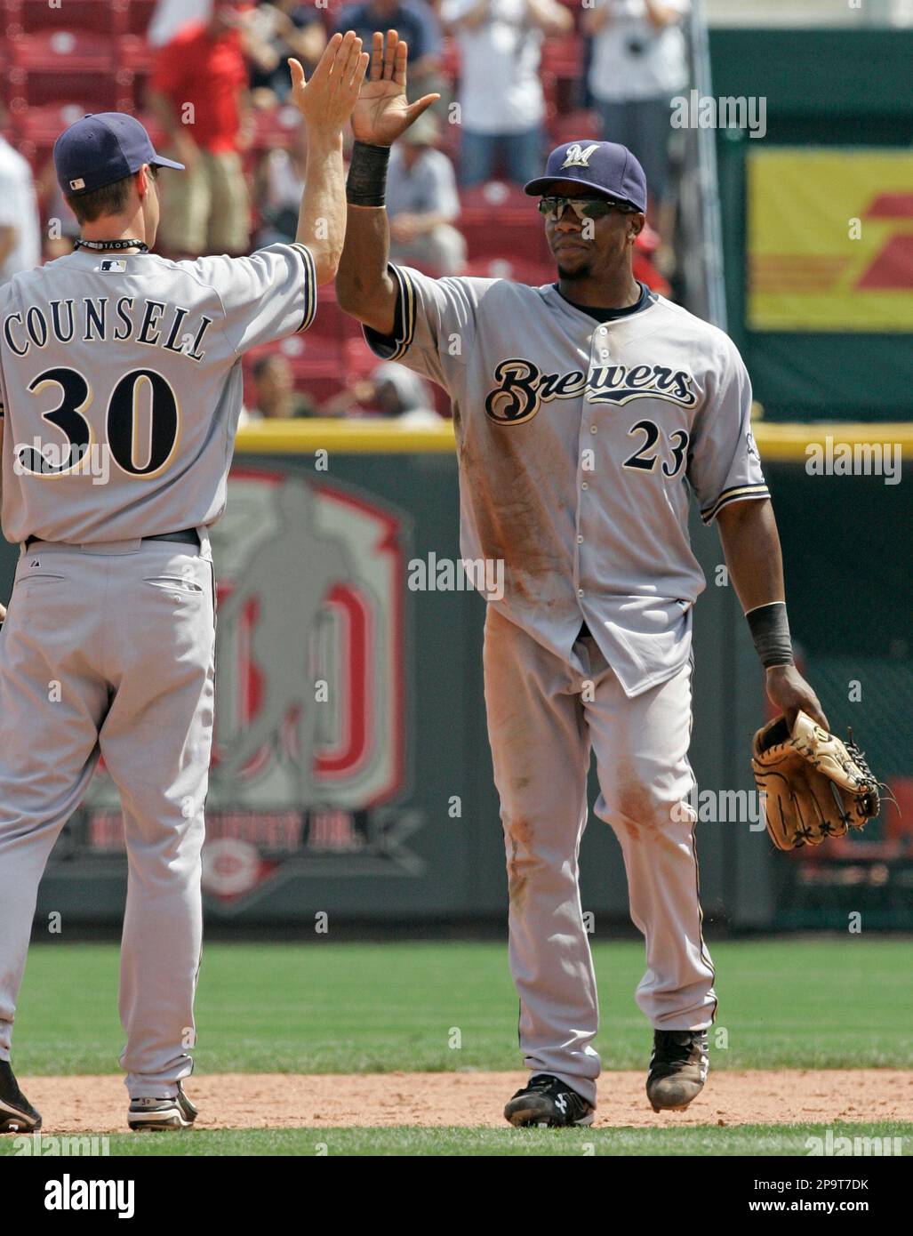 Milwaukee Brewers' Rickie Weeks (23) high-fives Craig Counsell after ...