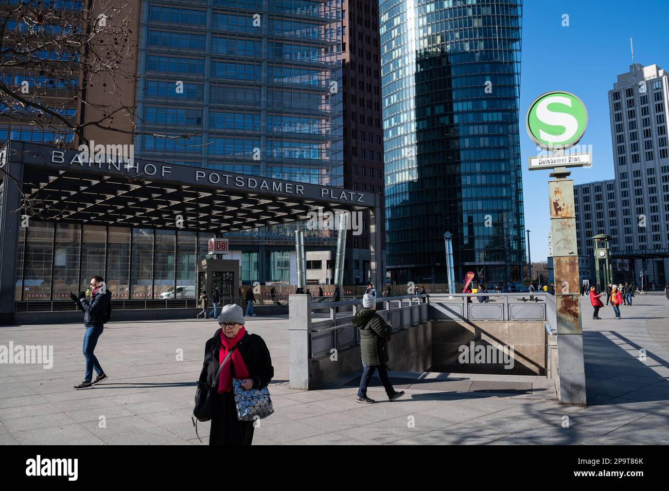 28.02.2023, Berlin, Germany, Europe - People in between high-rise ...
