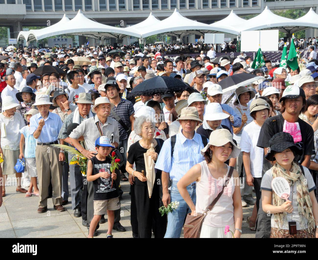 People make a line to pray for the victims to mark the 63th anniversary ...