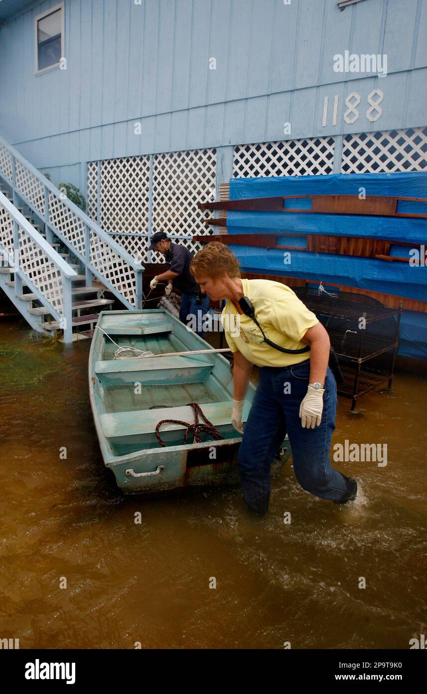 Emergency Medical Technicians Charlie Bouse, back, and Johnette Hughes ...