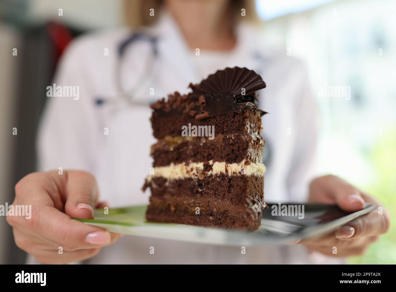 Female dietologist ask avoiding unhealthy sweet foods Stock Photo - Alamy