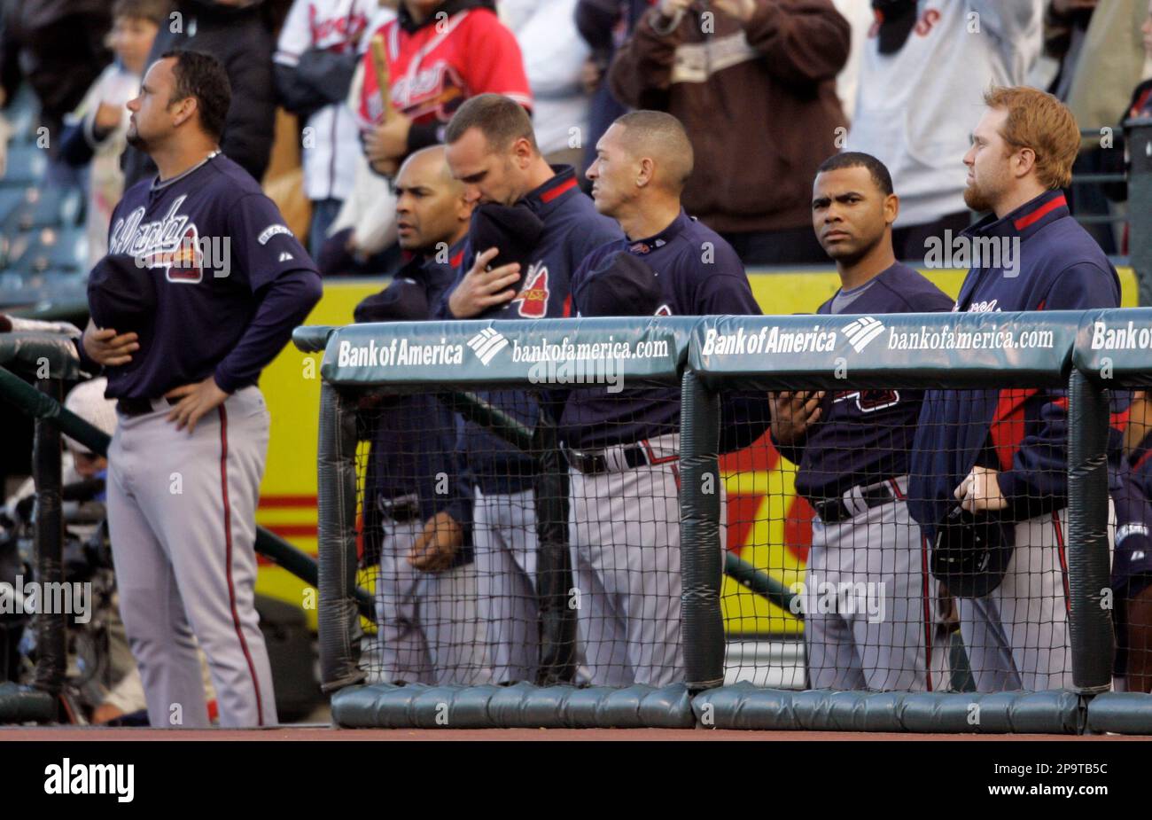 Members of the Atlanta Braves observe a moment of silence for Braves ...