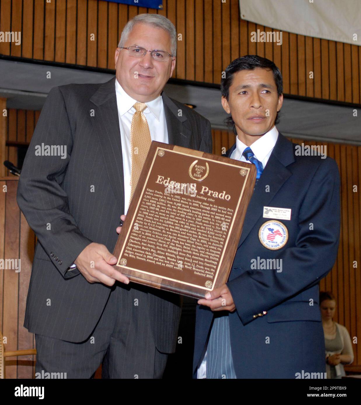 Jockey Edgar Prado, right, receives his hall of fame plaque from Robert ...