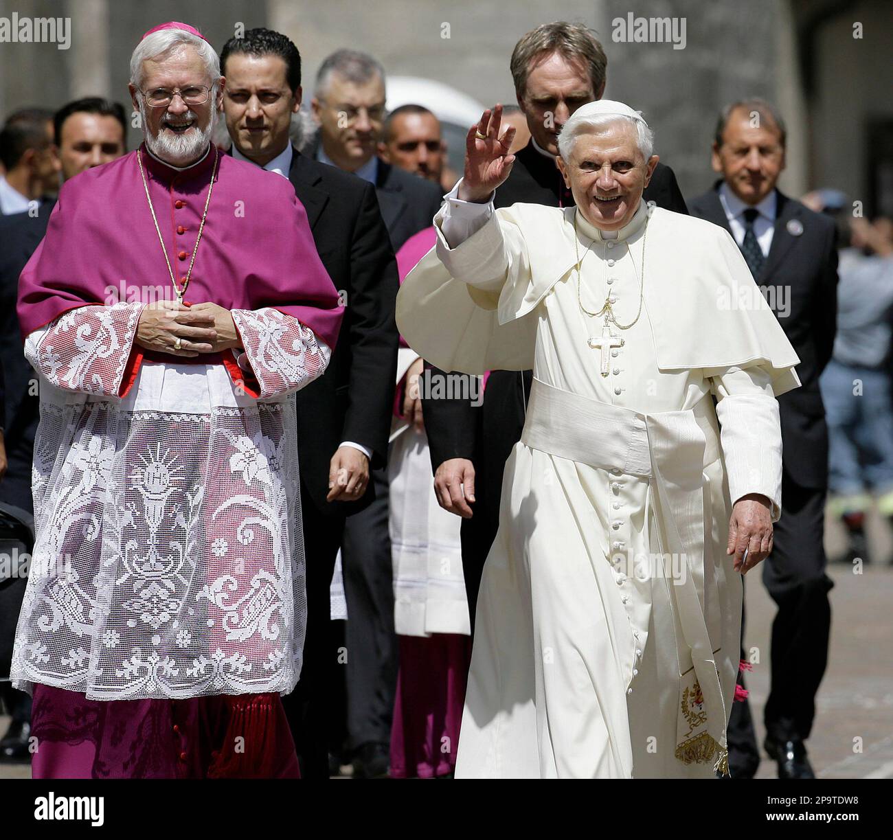 Pope Benedict XVI, right, greets the faithful as he arrives for the ...
