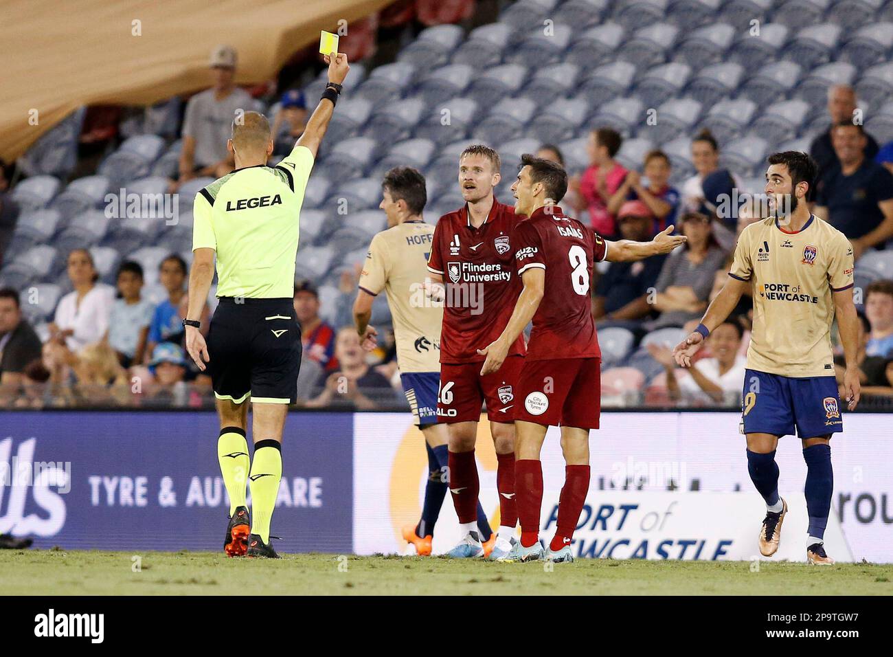 Ben Halloran of Adelaide United receives a yellow card during the A ...
