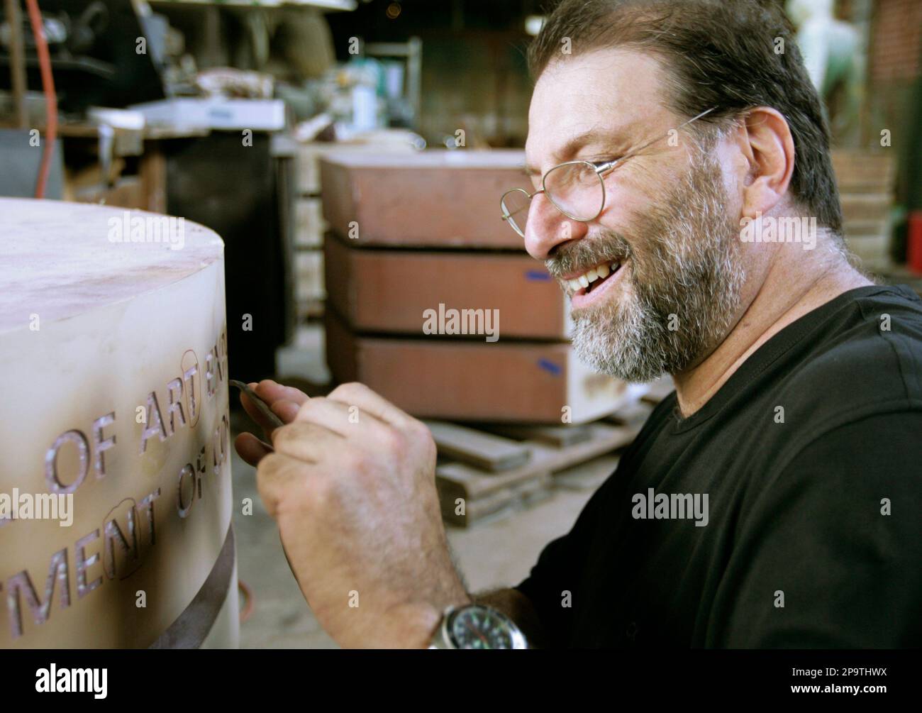 Sculptor Charles Ponticello works on his sculpture that has been ...