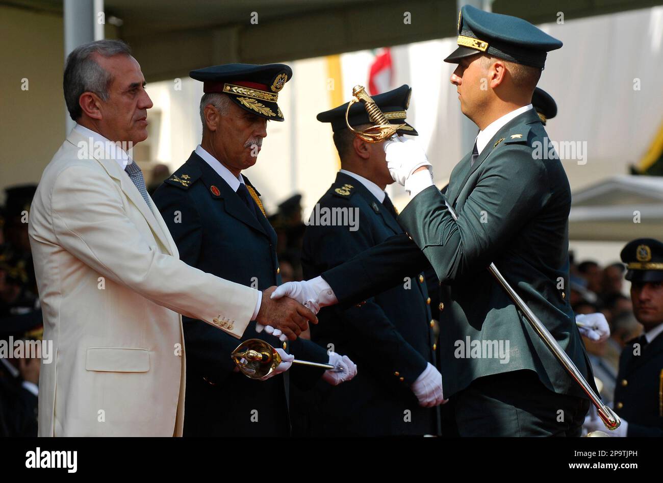 Lebanese President Michel Suleiman, left, shakes hands with a newly ...